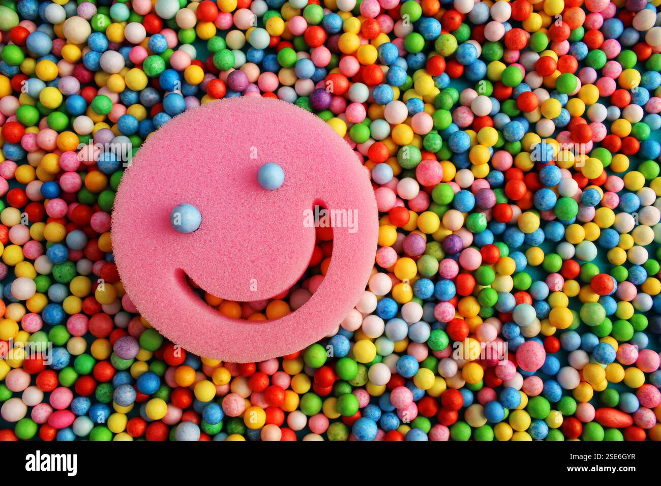 Happiness face on colorful spheres Stock Photo - Alamy