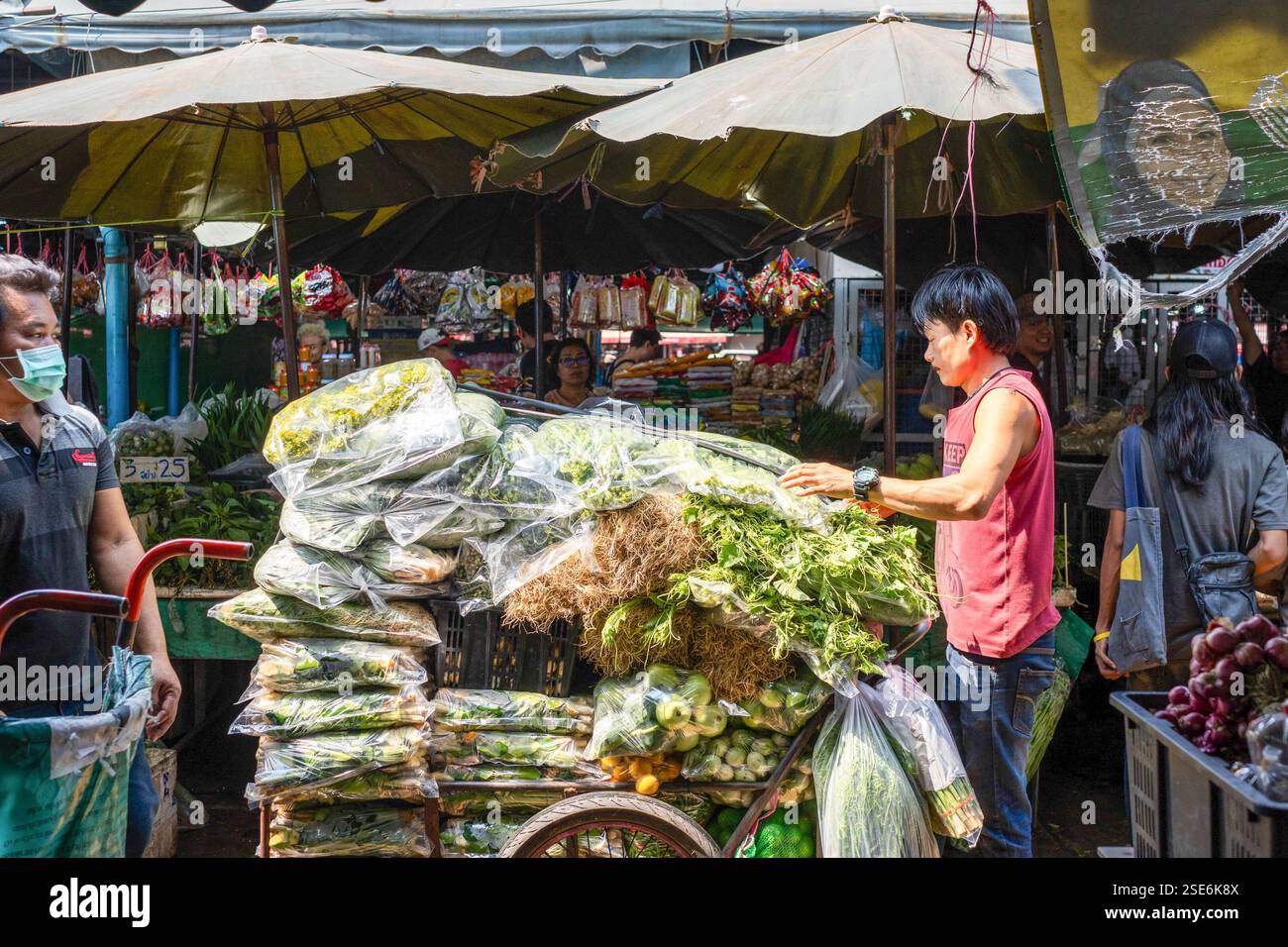 Bangkok, Thailand. 8th Feb, 2025. A man is seen delivering wholesale ...