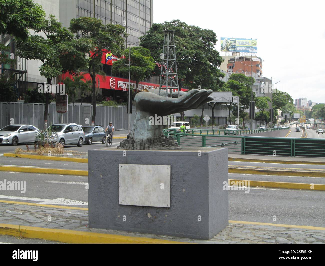 View of an oil sculpture with the main office of Petroleos de Venezuela ...