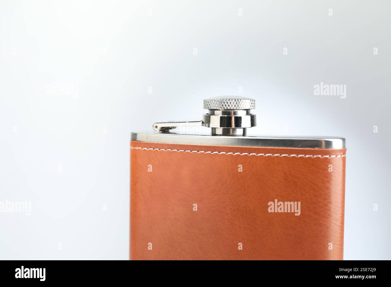 Hip flask on white background, closeup. Space for text Stock Photo - Alamy