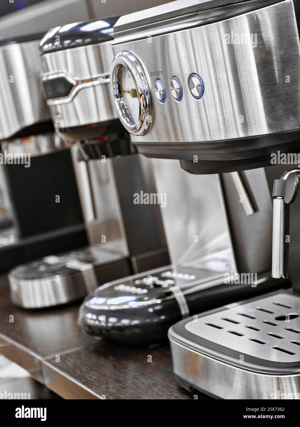 Sophisticated coffee machines lined up in a modern cafe setting, ready ...