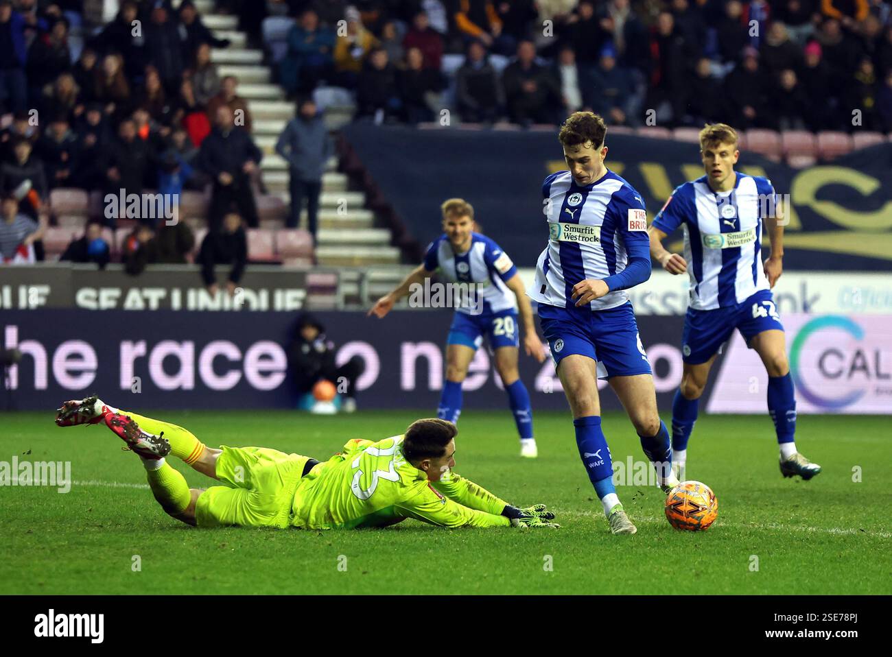Fulham goalkeeper Steven Benda saves a shot from Wigan Athletic's ...