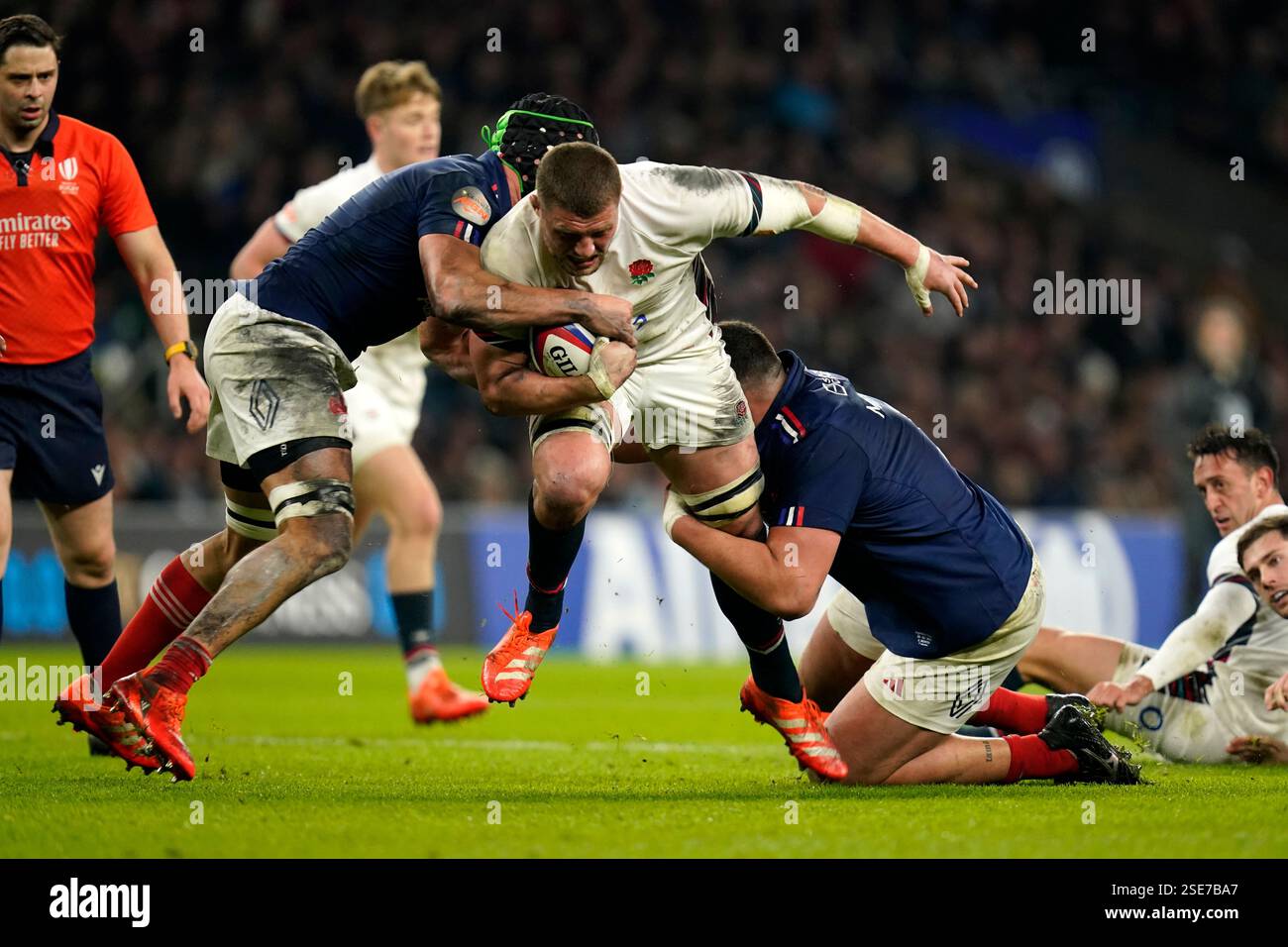 England's Tom Willis is tackled by France's Gregory Alldritt (left) and ...