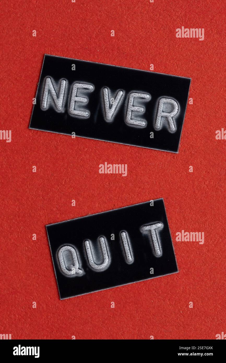 Never quit words on black and red background. Motivational and ...