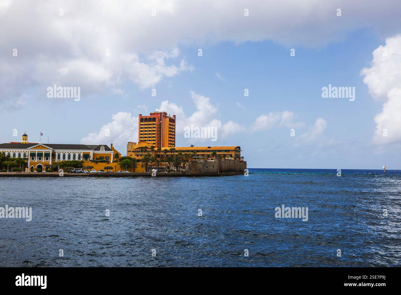 Seaside view of historic waterfront with colonial buildings and tall ...