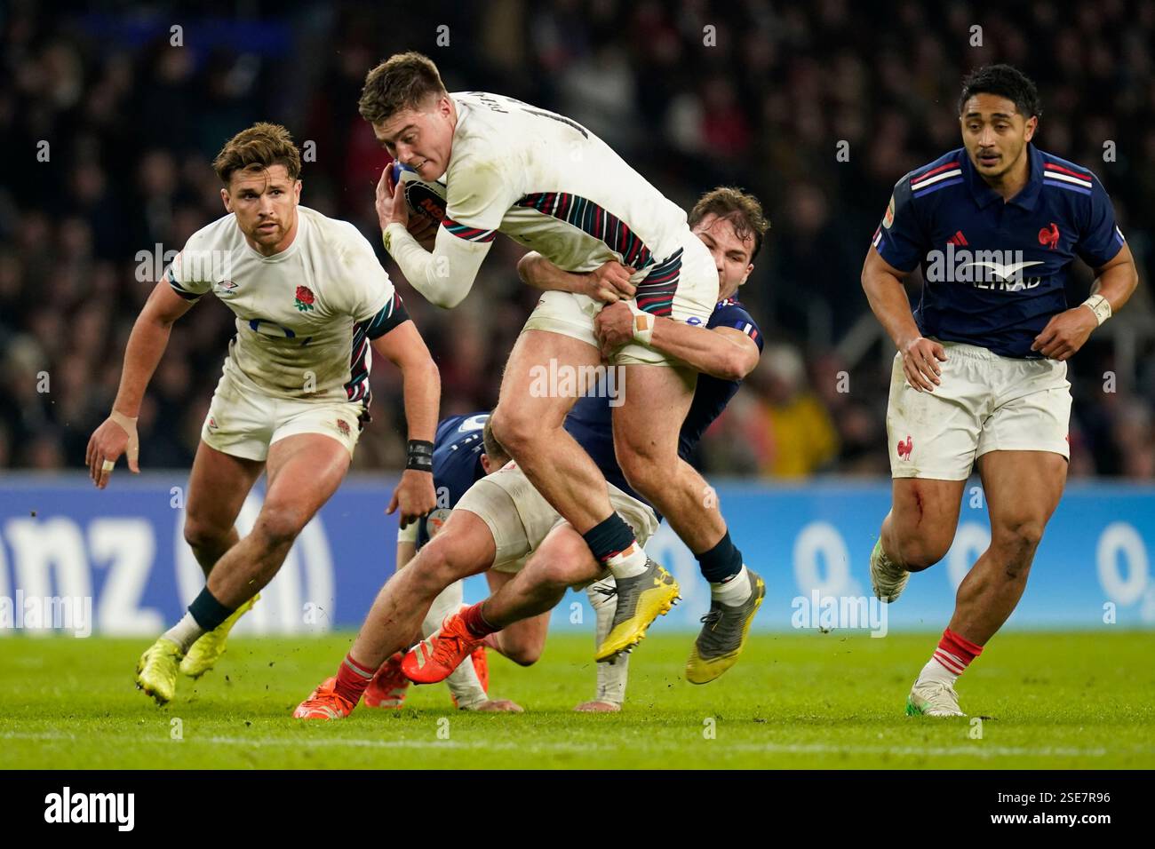 England's Tommy Freeman is tackled by France's Antoine Dupont (right) during the Guinness Men's ...