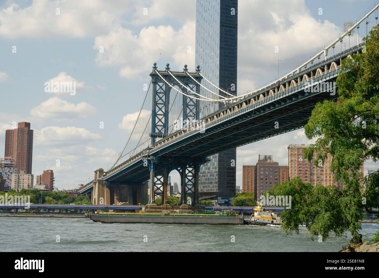 Manhattan Bridge spans across the river, connecting neighborhoods ...