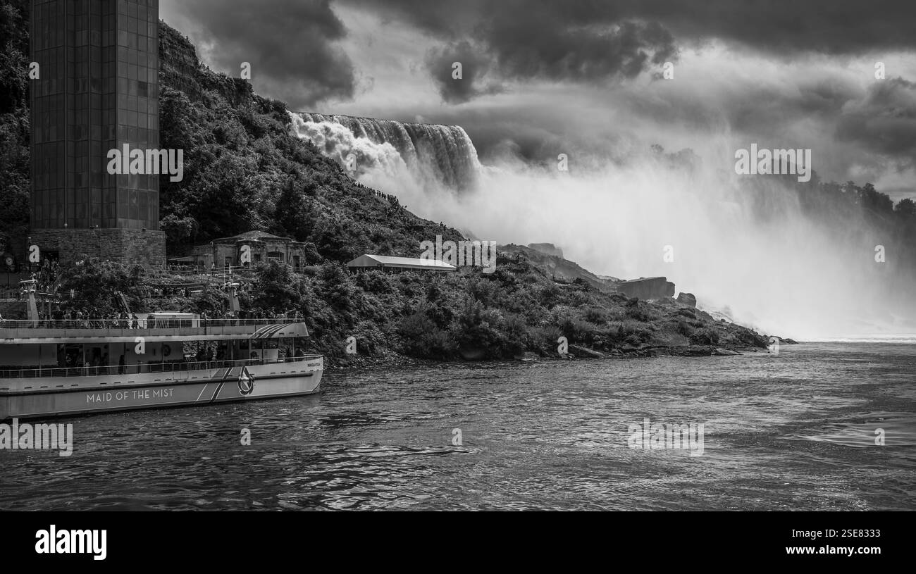 Powerful waterfalls thunder down rocky cliffs, surrounded by lush ...