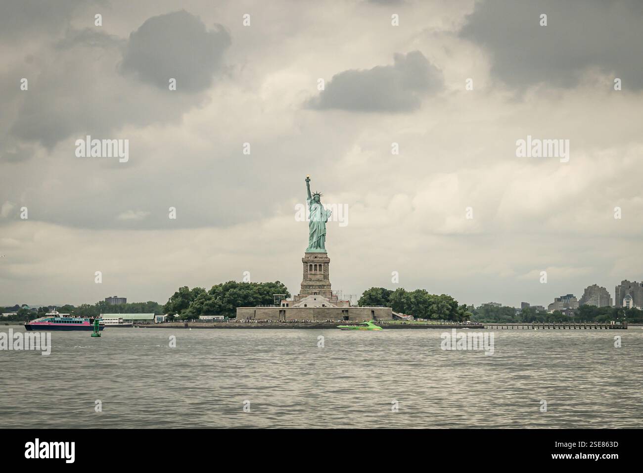 Statue of Liberty towers over Liberty Island, symbolizing freedom and ...
