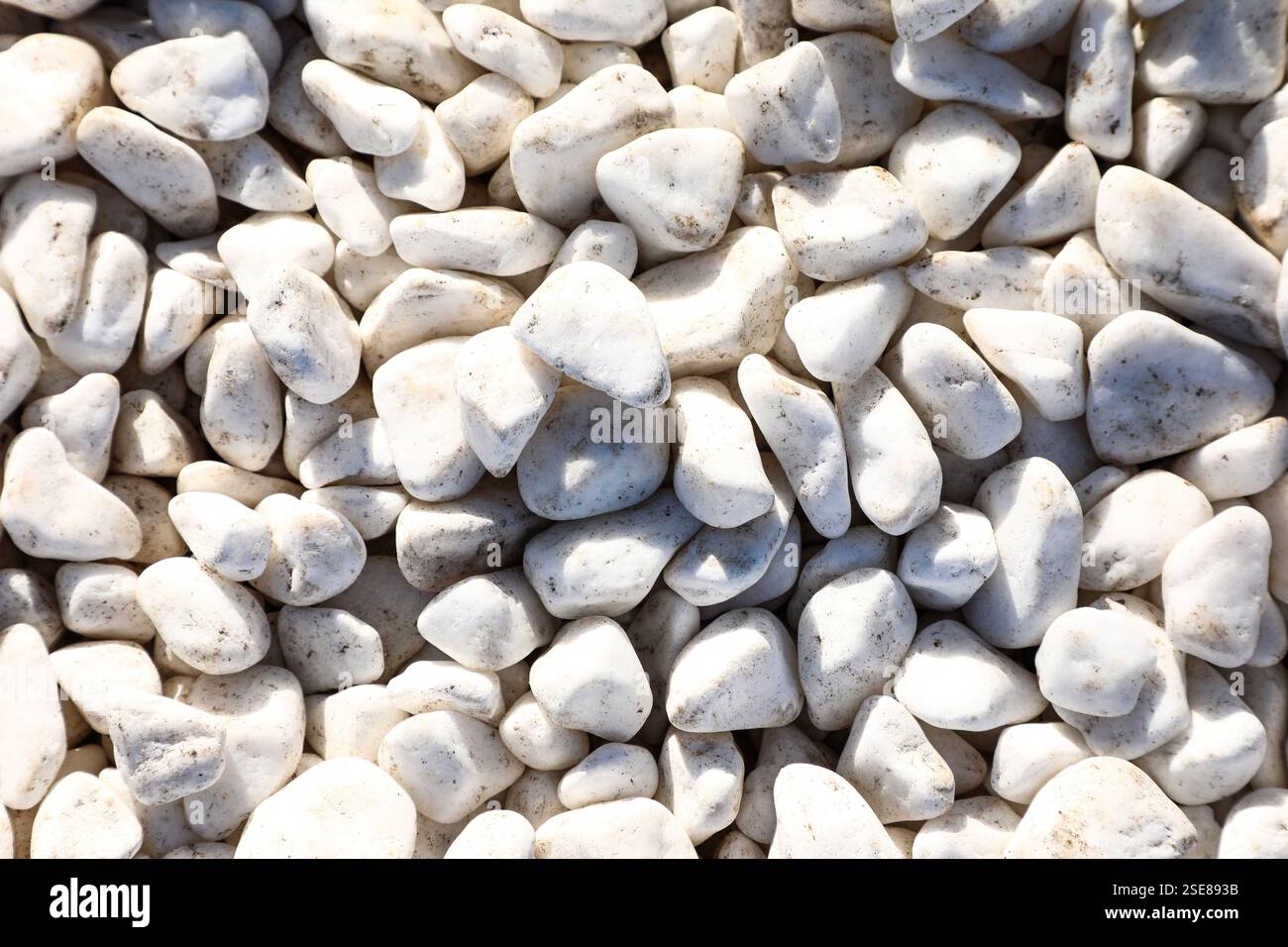 Many white stones as background Stock Photo - Alamy