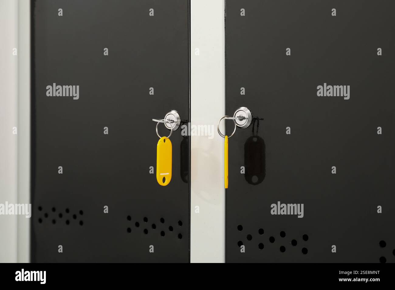 Modern lockers with bright keys, closeup view Stock Photo - Alamy