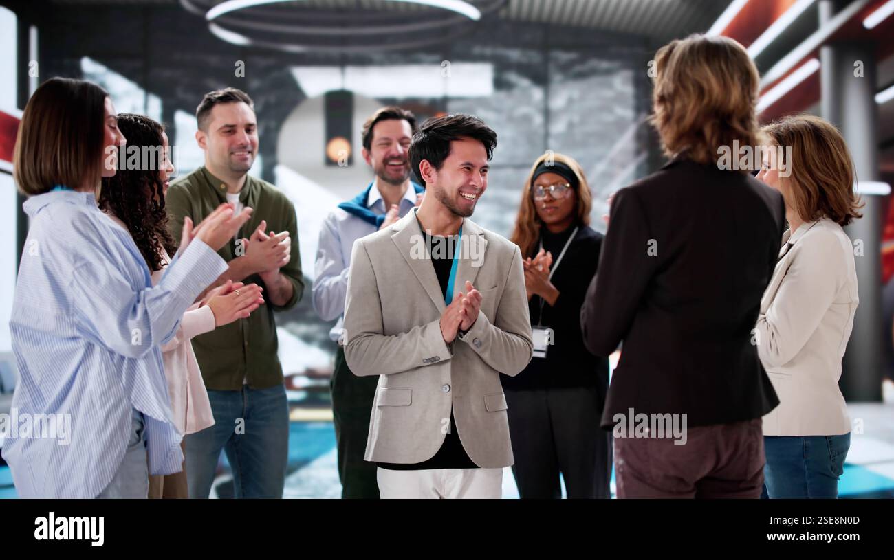 Celebrating success: diverse office team congratulating employee on ...