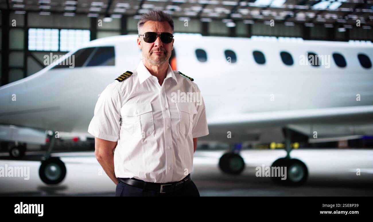 Private Jet Captain Pilot In Uniform. Small Airplane At Airport Stock ...