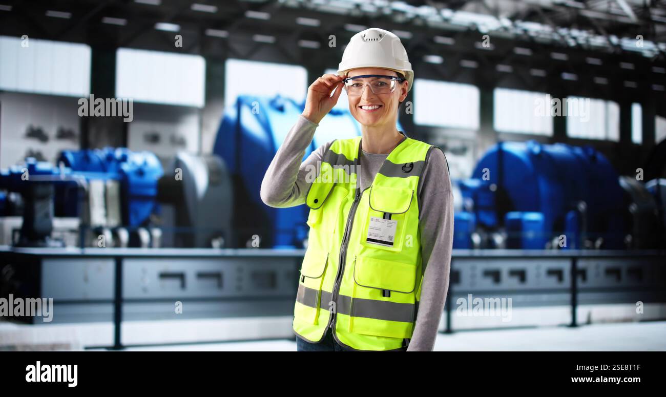 The Woman Engineer Operates Machinery at an Oil and Gas Refinery Stock ...