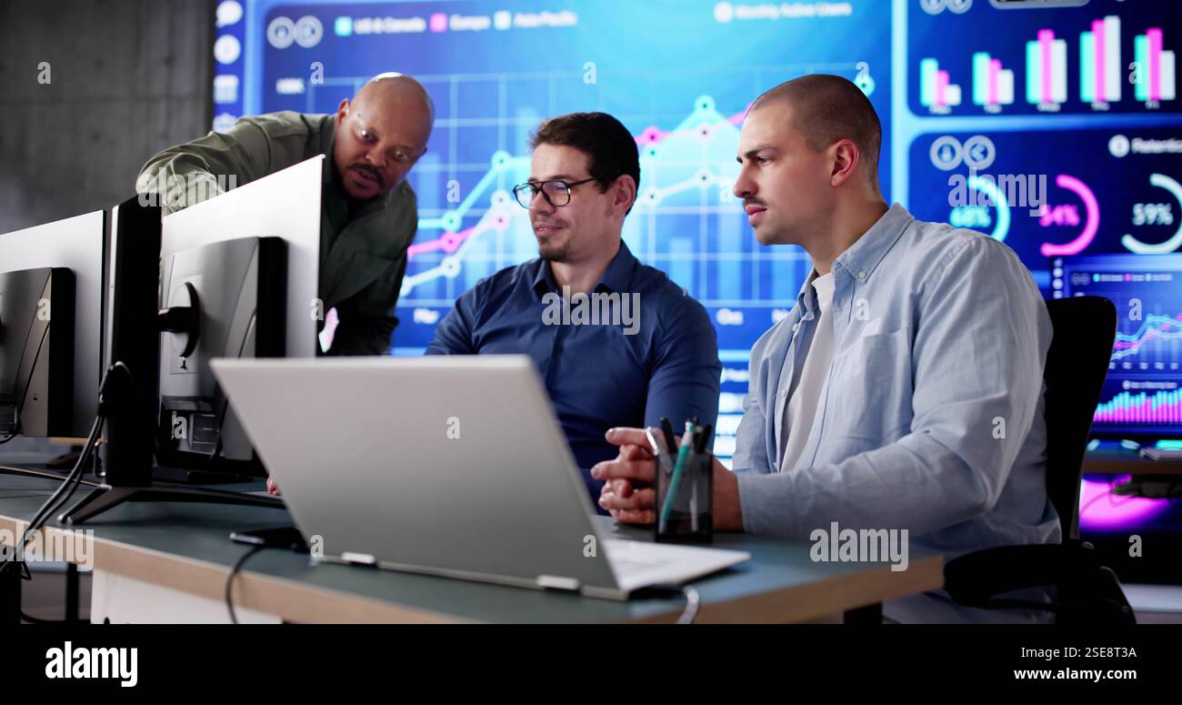 Data center analyst monitoring KPI dashboard on server control monitor ...