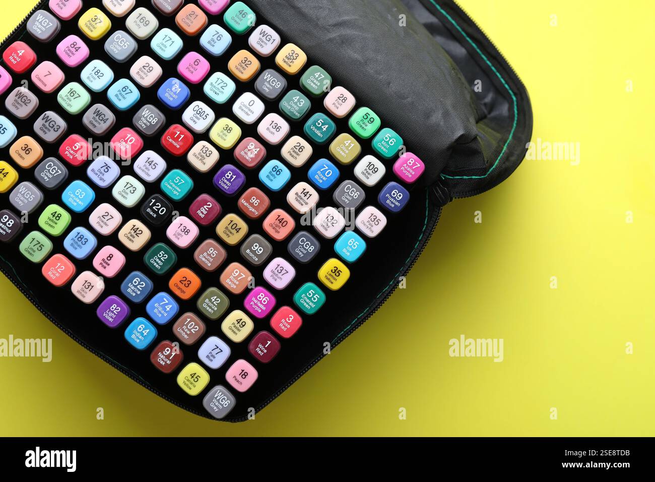 Different double sided markers on yellow background, top view Stock ...