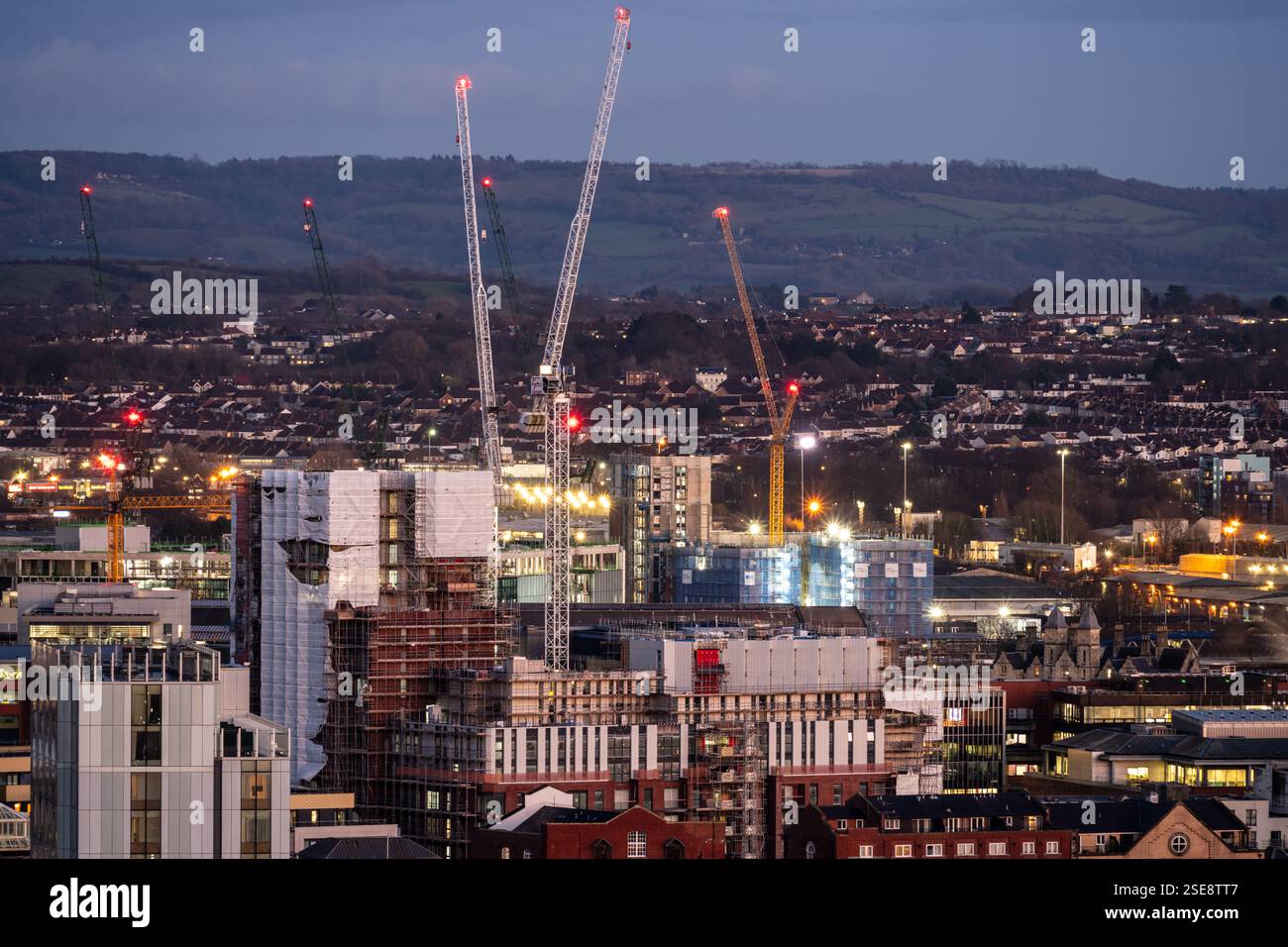 Construction cranes tower over building sites in the Redcliffe ...