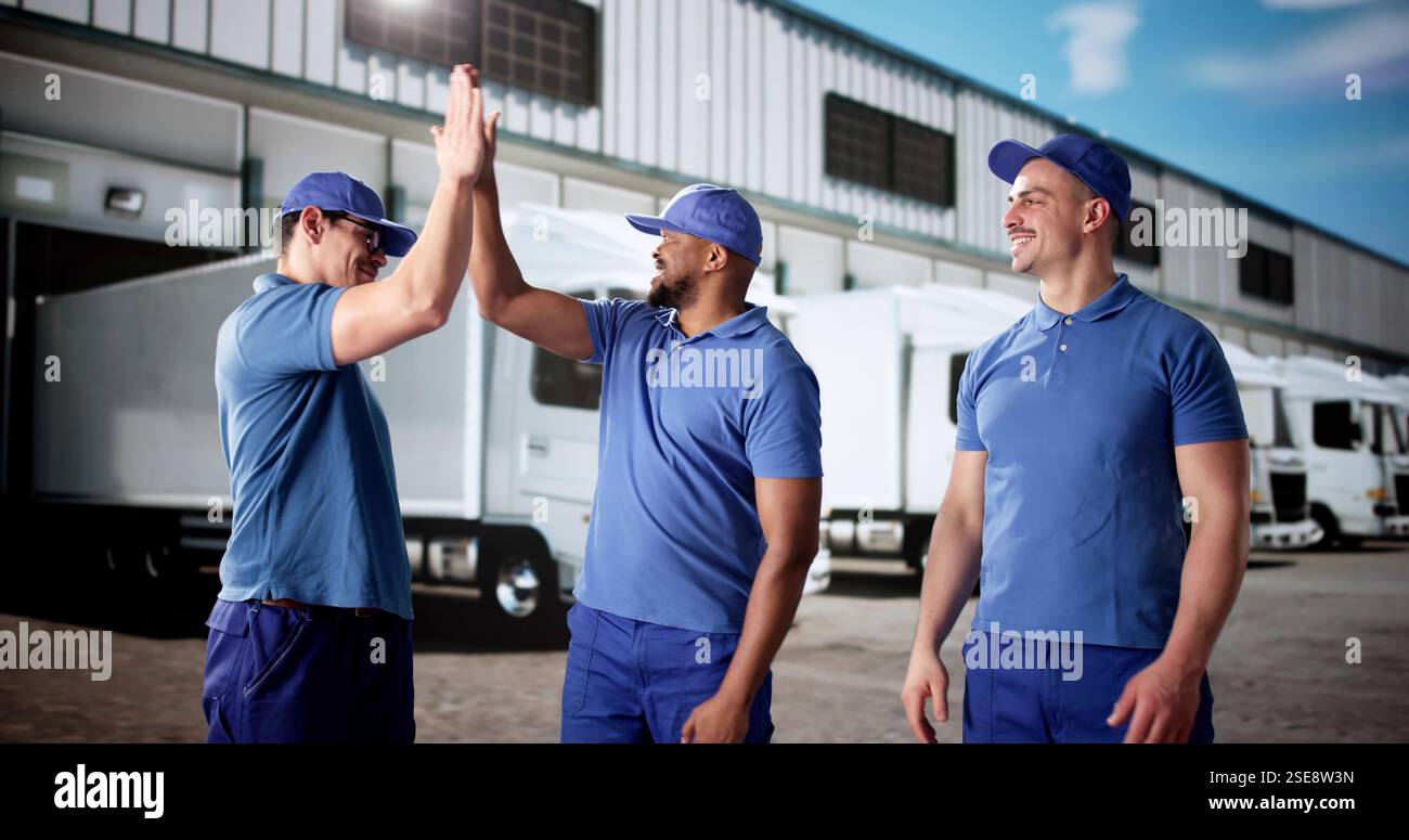 Celebrating success in logistics: diverse group of happy truck drivers ...