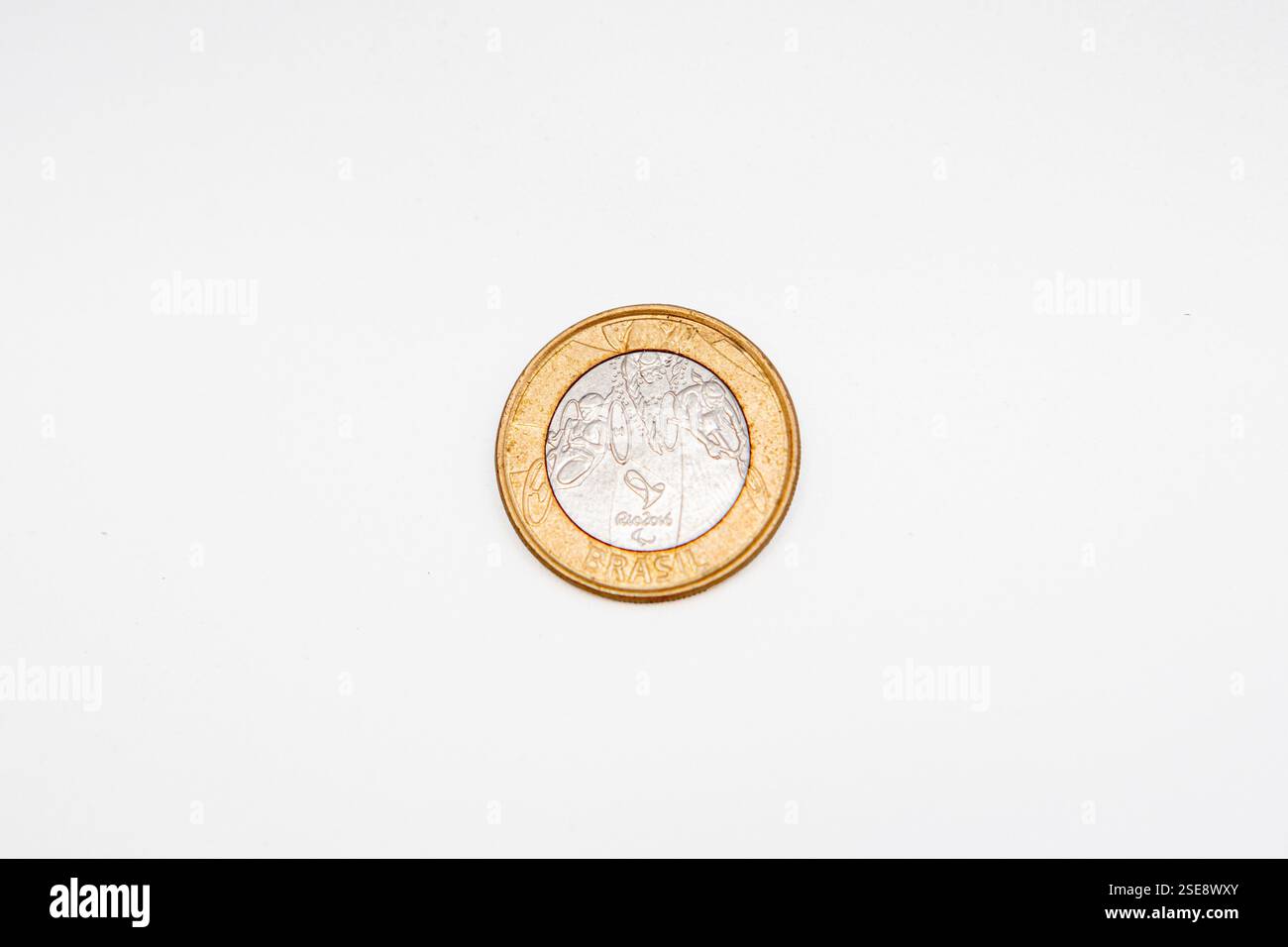 1 real coin commemorating the olympics on a white background in rio de ...