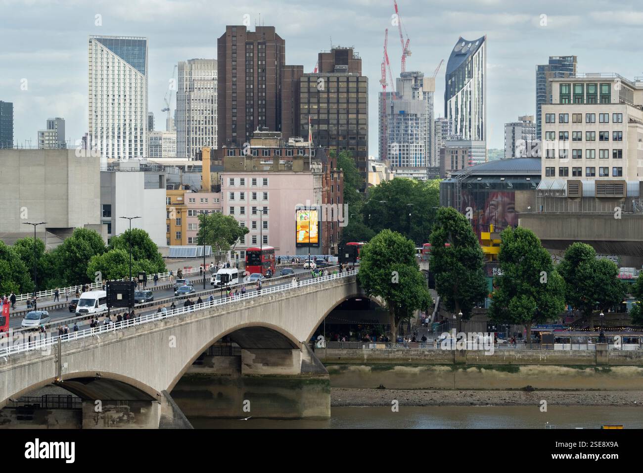 Pedestrians and vehicles on Waterloo Bridge, crossing the River Thames ...