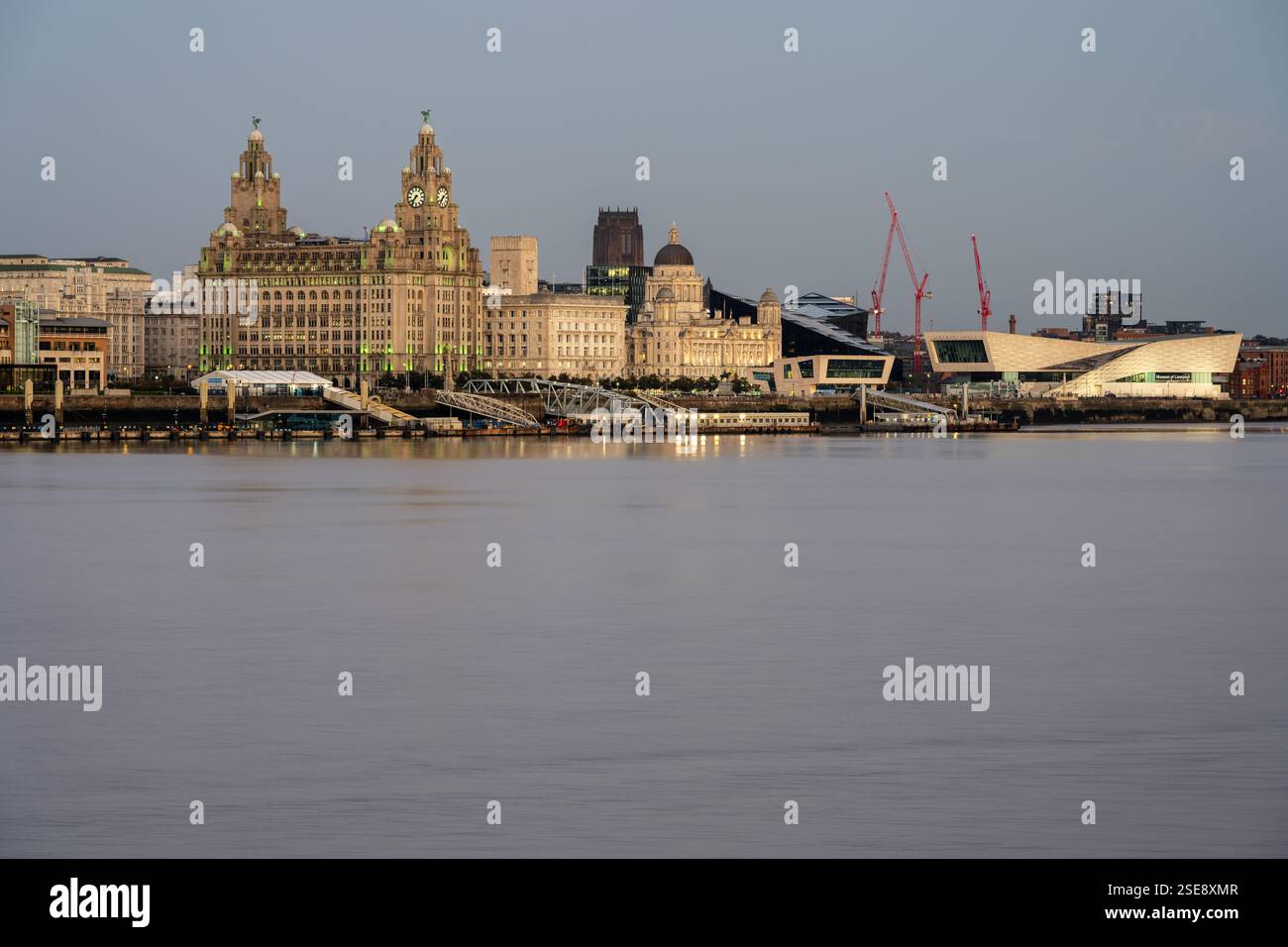 The iconic skyline of Liverpool's Pierhead is lit at dusk on England's ...