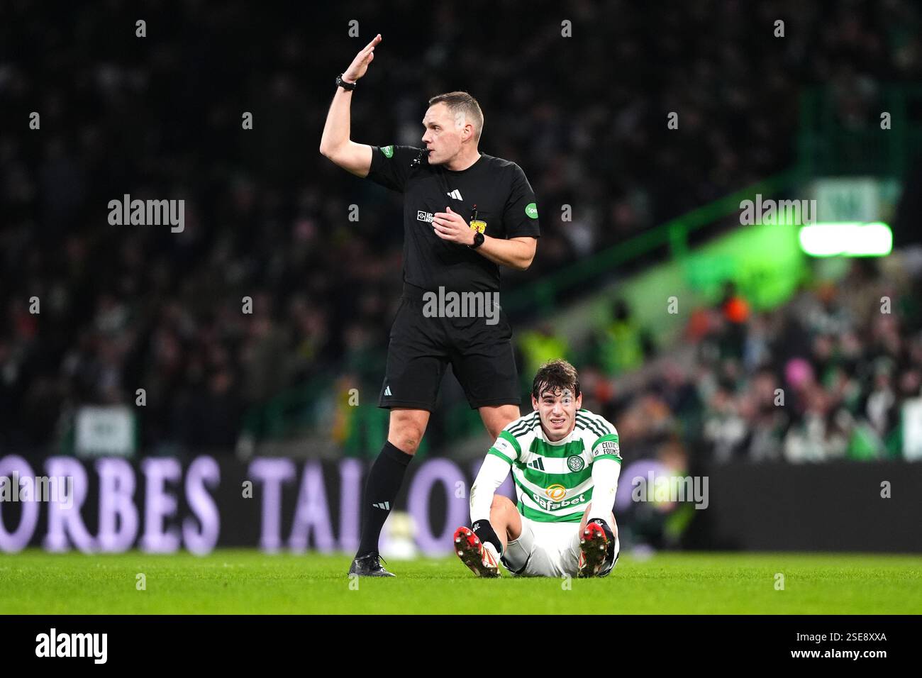 Referee Chris Graham (left) stops play as Celtic's Paulo Bernardo ...