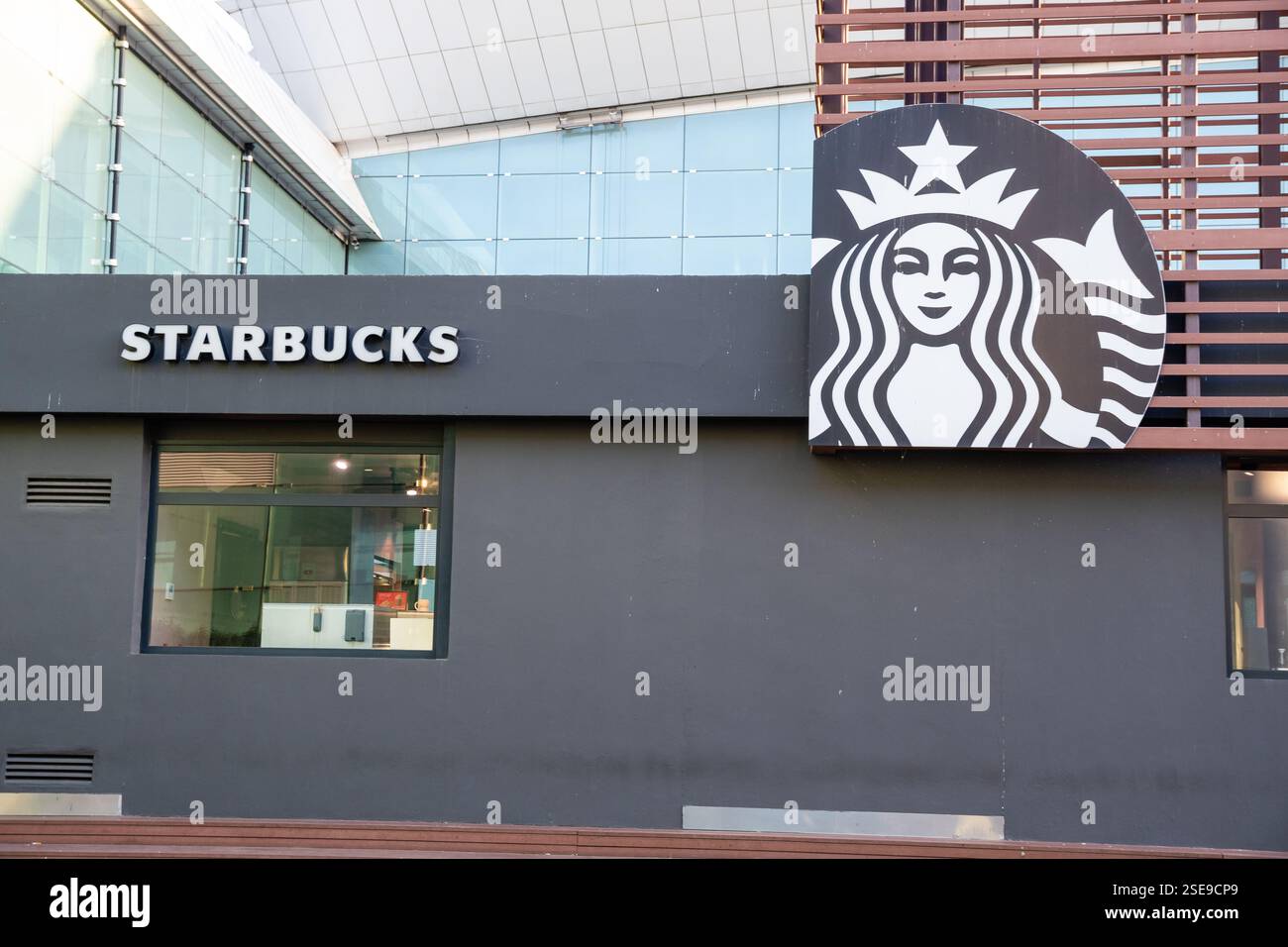 Modern Starbucks outlet at Barcelona Airport with minimalist black ...