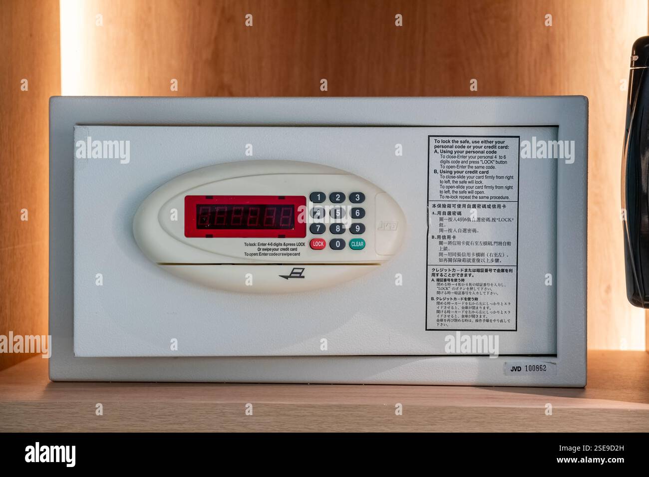 Electronic hotel safe with keypad and multilingual instructions ...