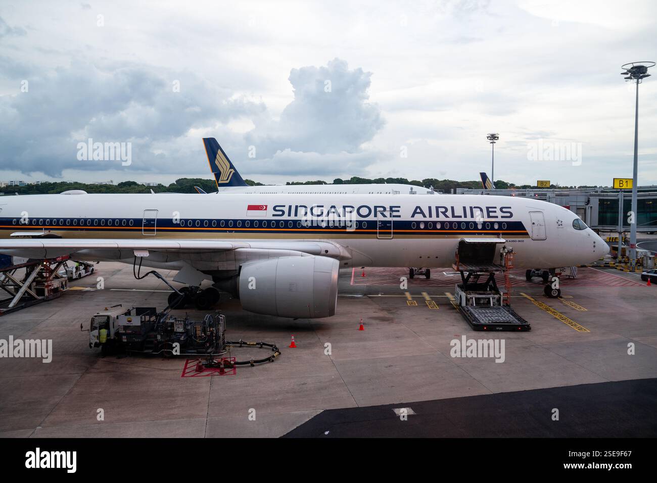 Singapore Airlines Airbus A350-900 at an airport gate, undergoing ...
