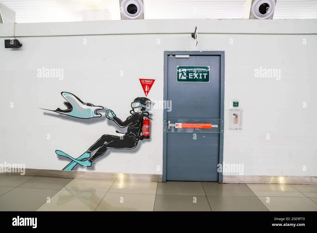 creative wall mural of a diver and manta integrating with a real fire ...