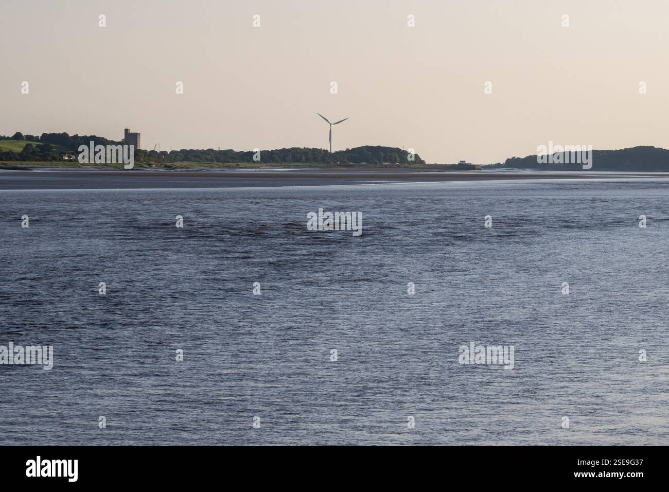 The Sharpness Dock wind turbine stands over the River Severn estuary as ...