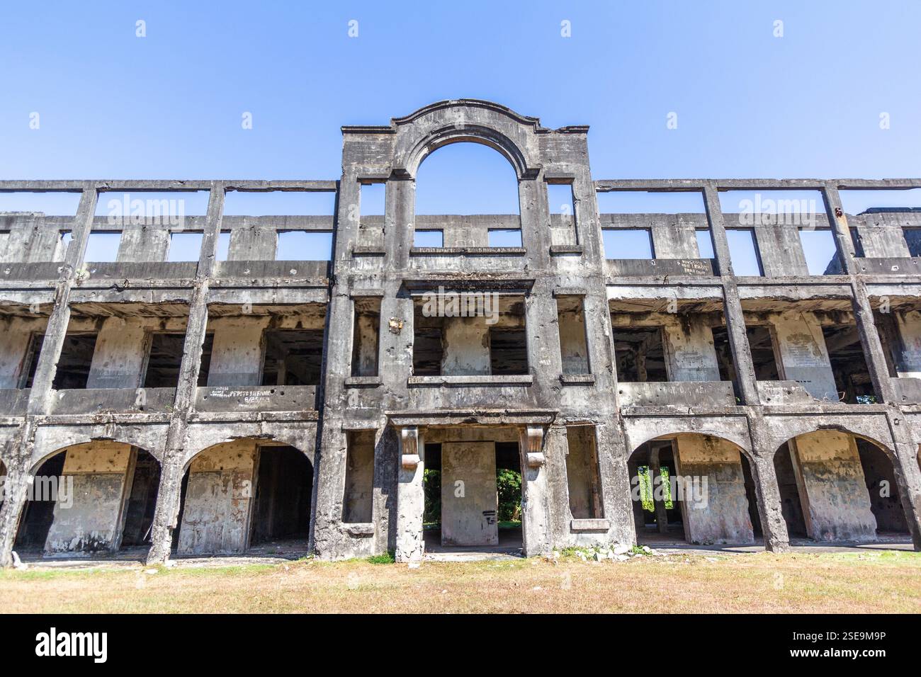 Ruins of the mile long barracks with crumbling walls and overgrown ...