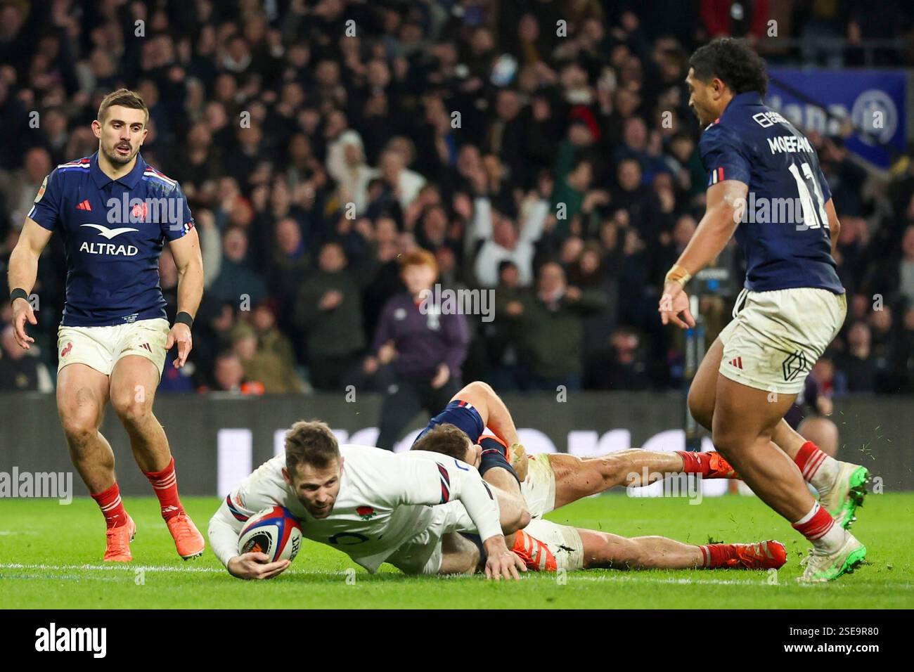 England's Elliot Daly, center, scores a try during the Six Nations ...