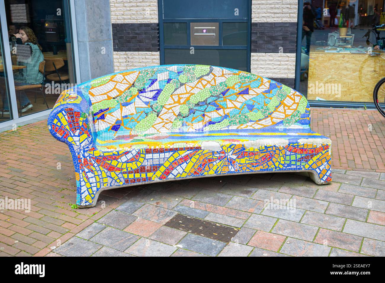 Beautiful bench with a mosaic pattern consisting of small colorful ...