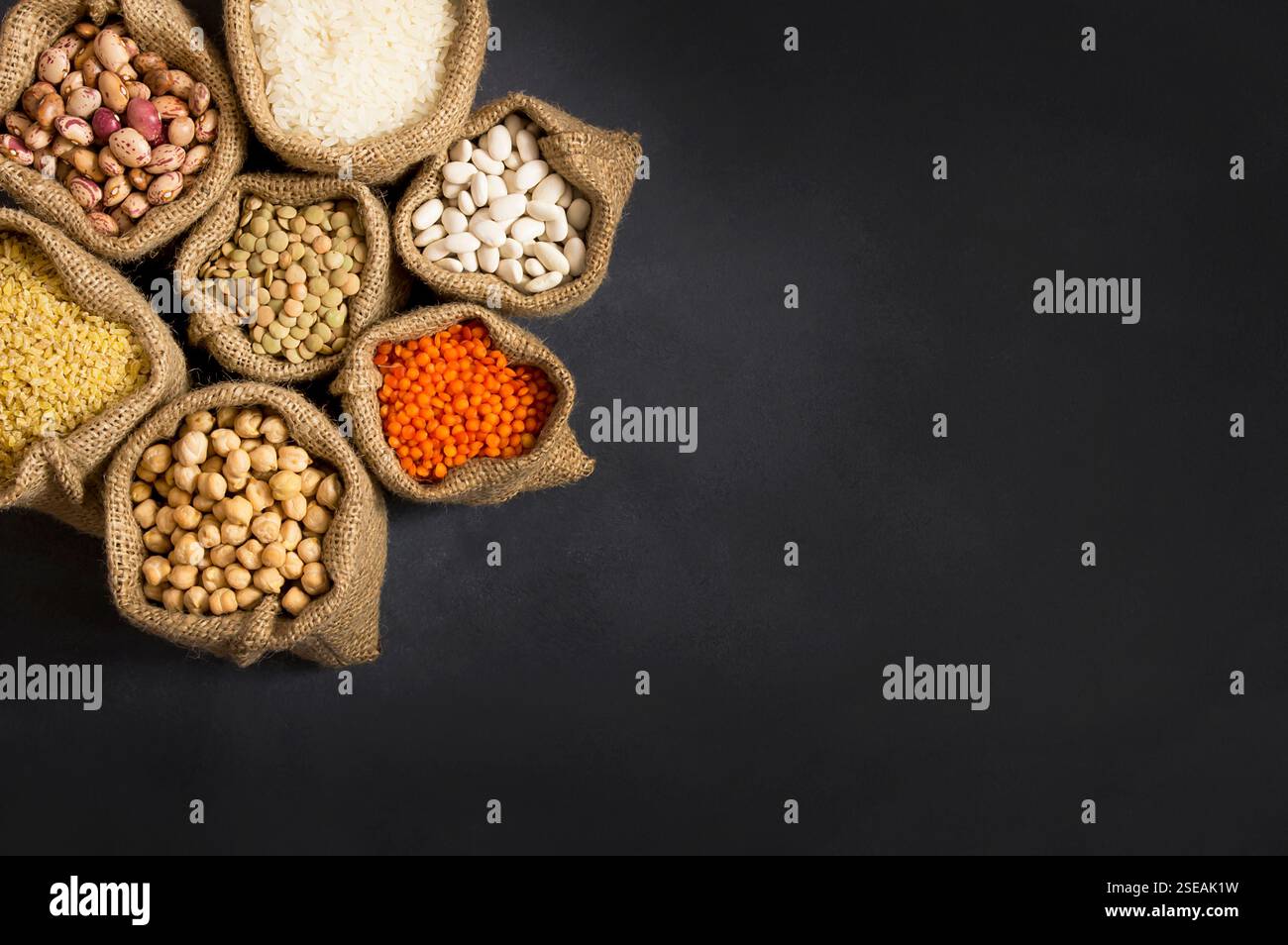 Different type of raw dry legumes composition. White beans, lentils ...