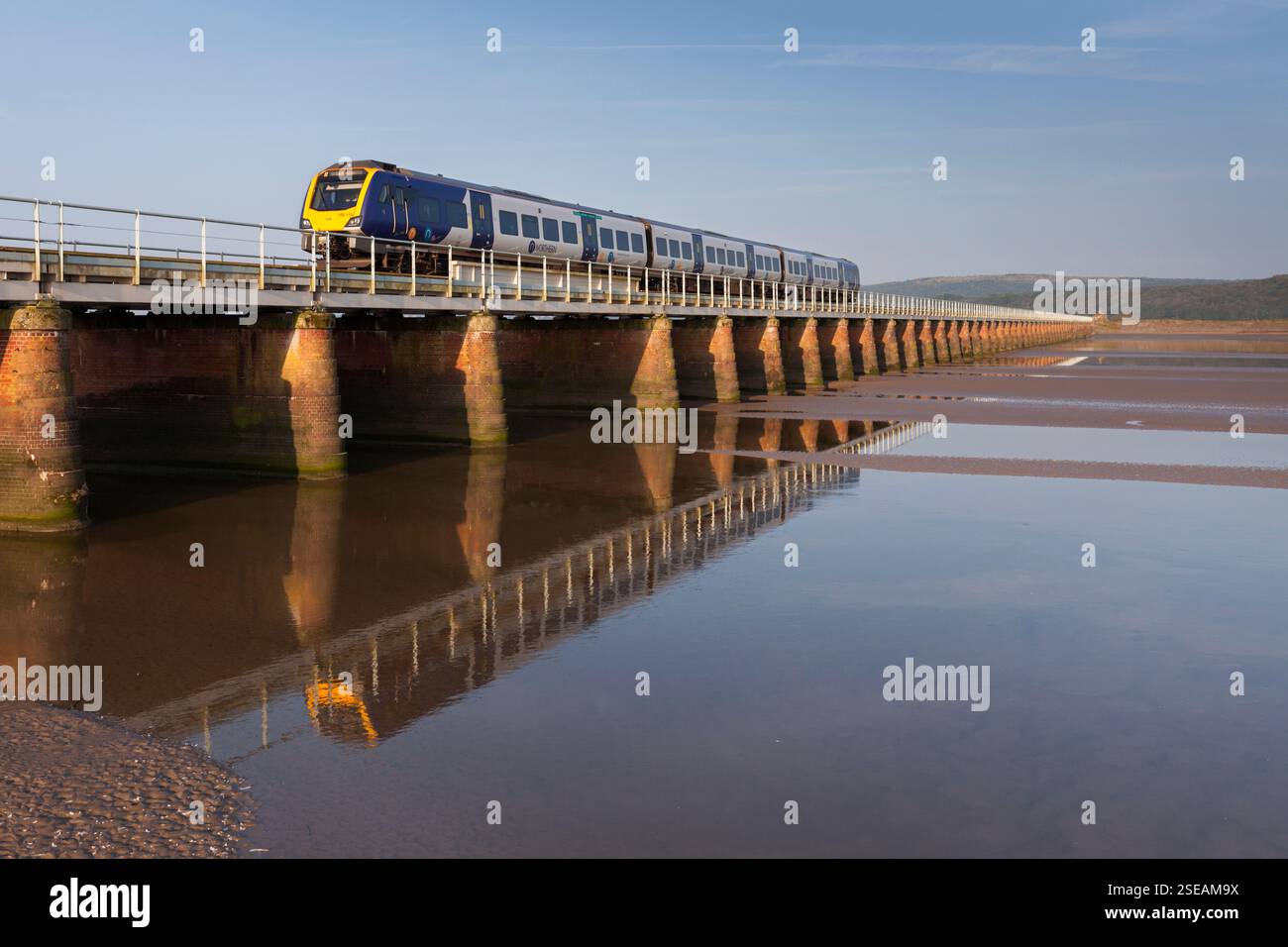 Northern rail class CAF 195 train crossing Arnside viaduct across the ...