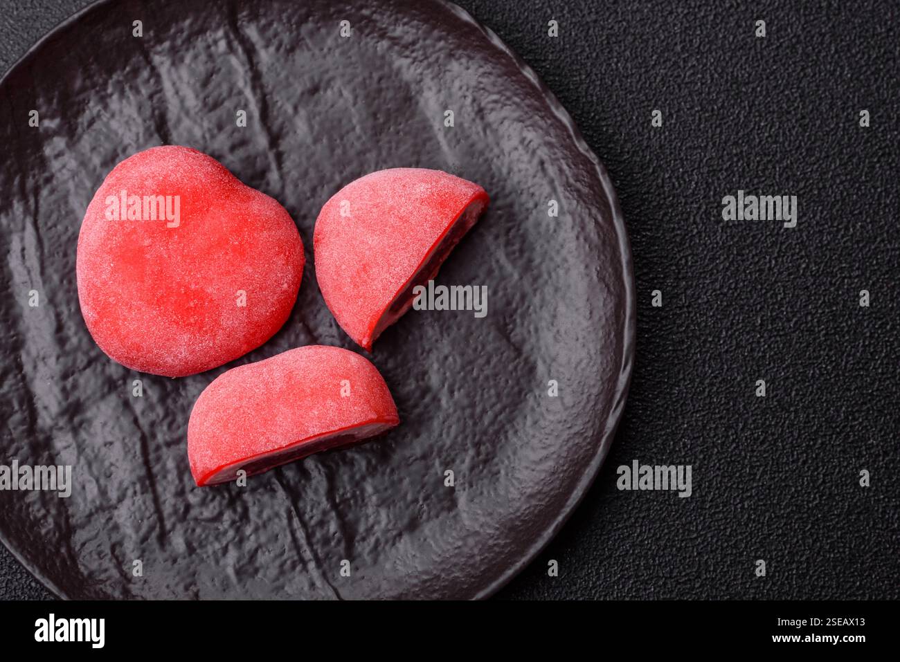 Delicious sweet mochi in the shape of red hearts for the holiday of ...