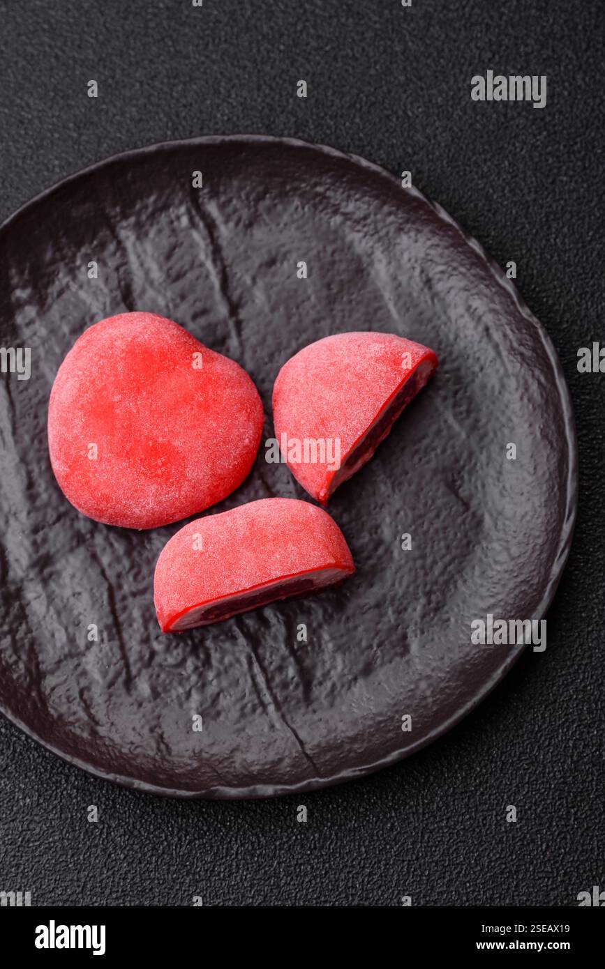 Delicious sweet mochi in the shape of red hearts for the holiday of ...