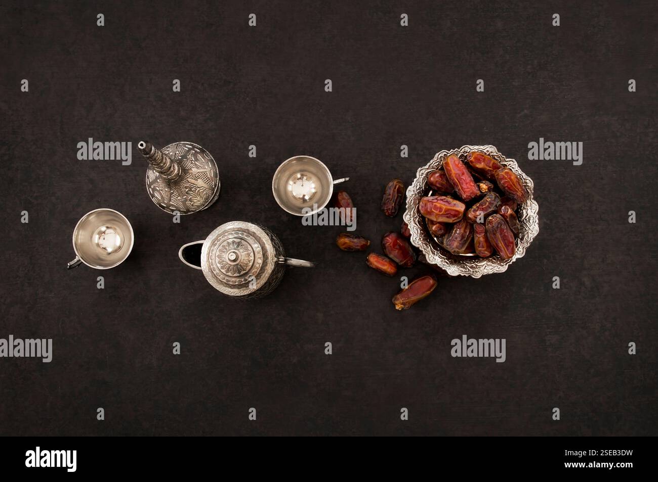 Ramadan kareem with dried dates and authentic metal zamzam water carafe ...