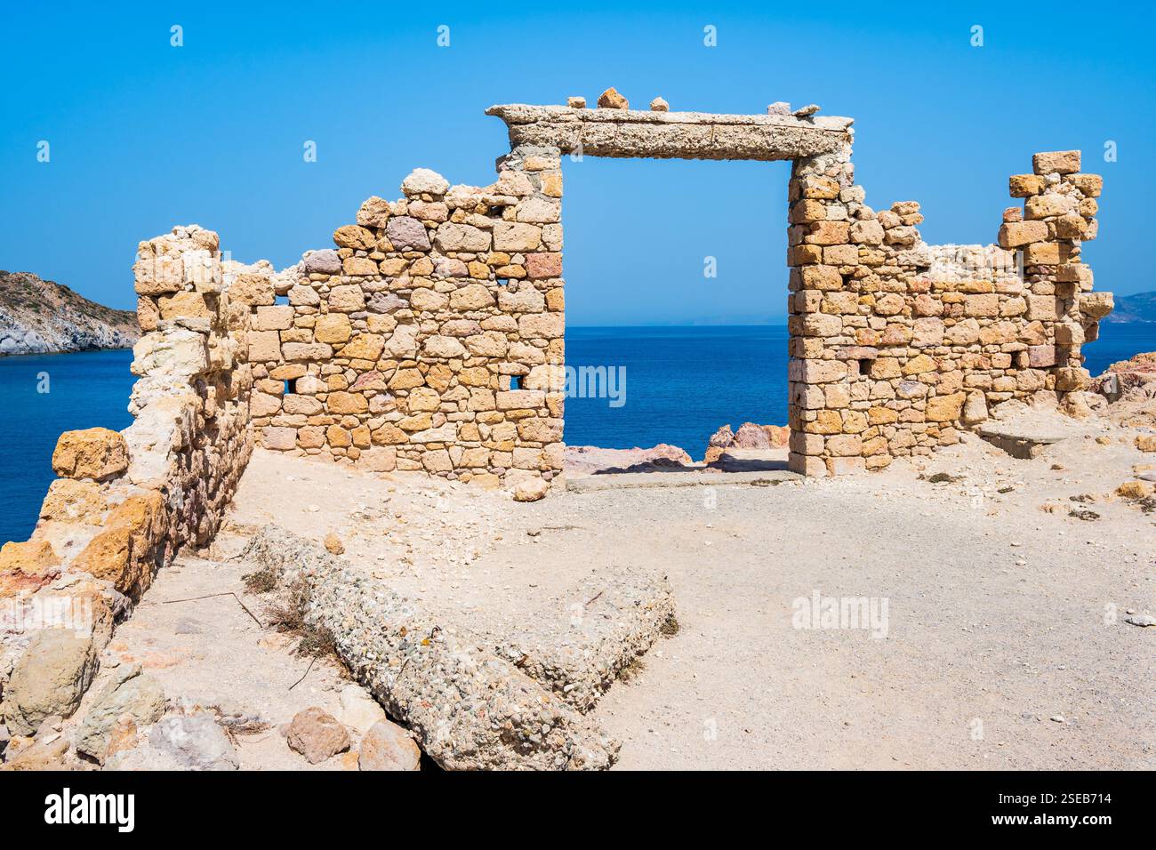 Old ruins of ancient gate to village in Firopotamos bay, Milos island ...