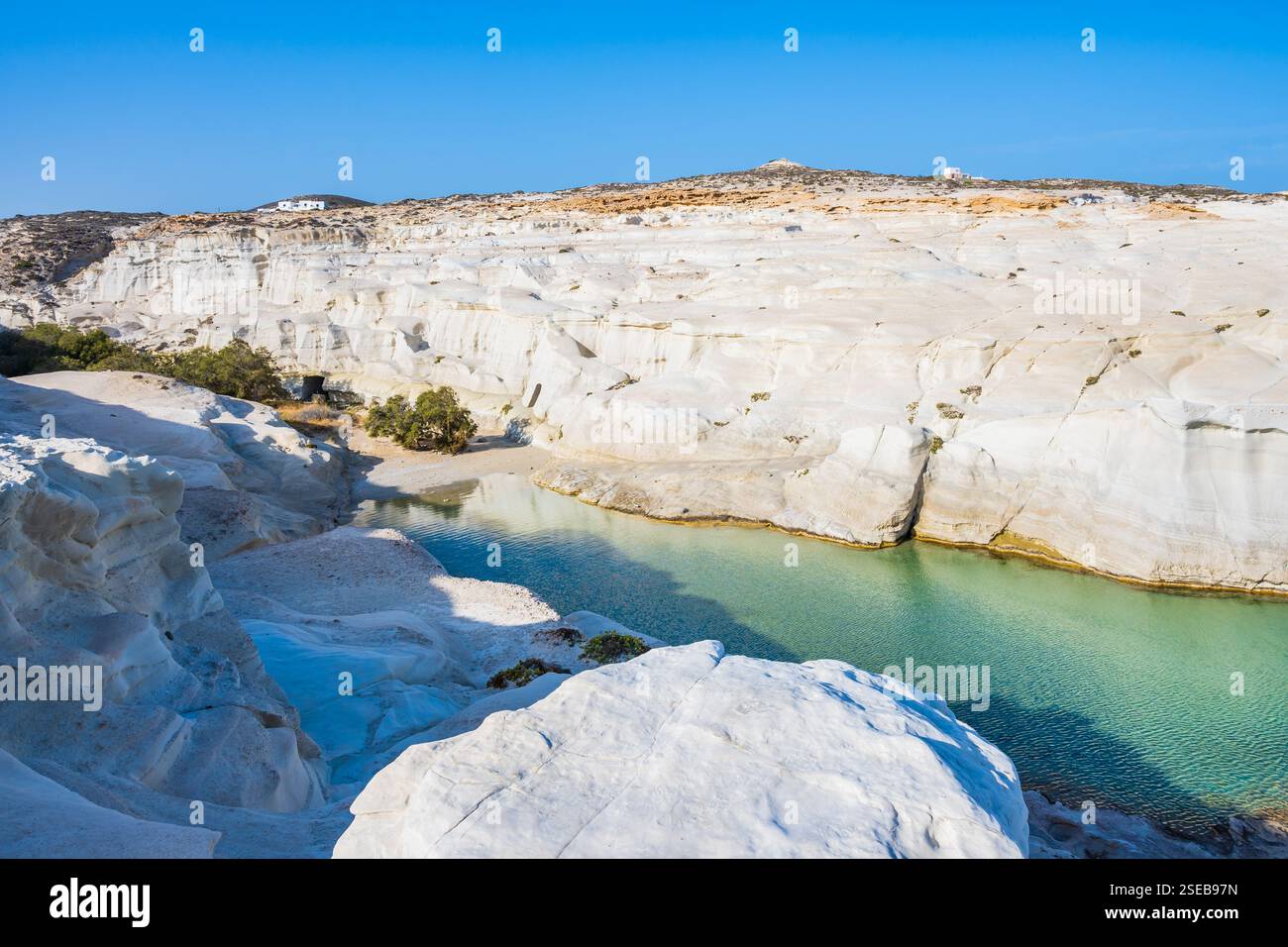 Rocky beach of Sarakiniko with crystal clear sea water bay, Milos ...