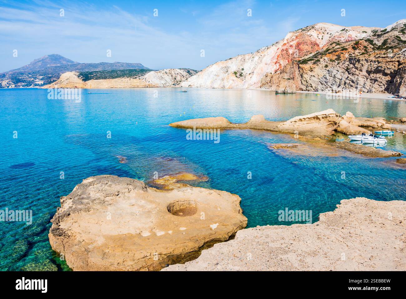 Sandy beach of Tsigrado with crystal clear sea water bay, Milos island ...