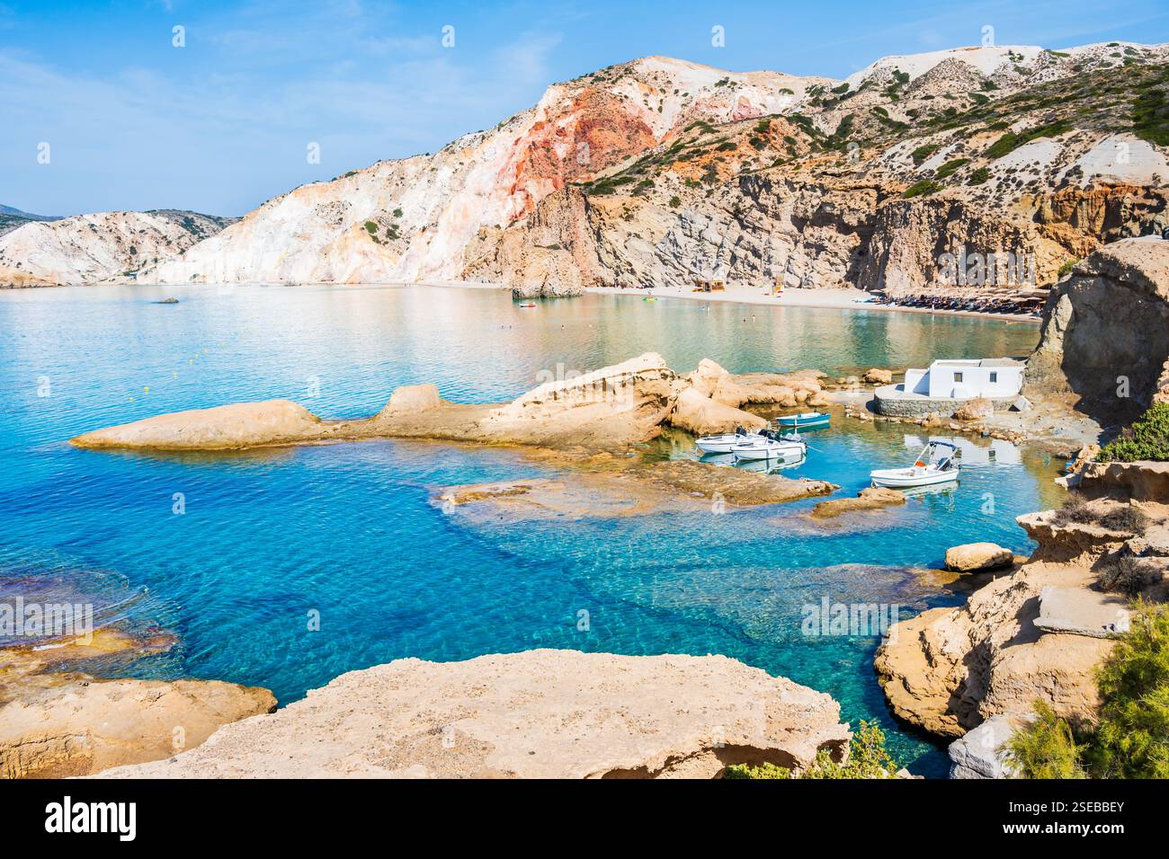 Sandy beach of Tsigrado with crystal clear sea water bay, Milos island ...