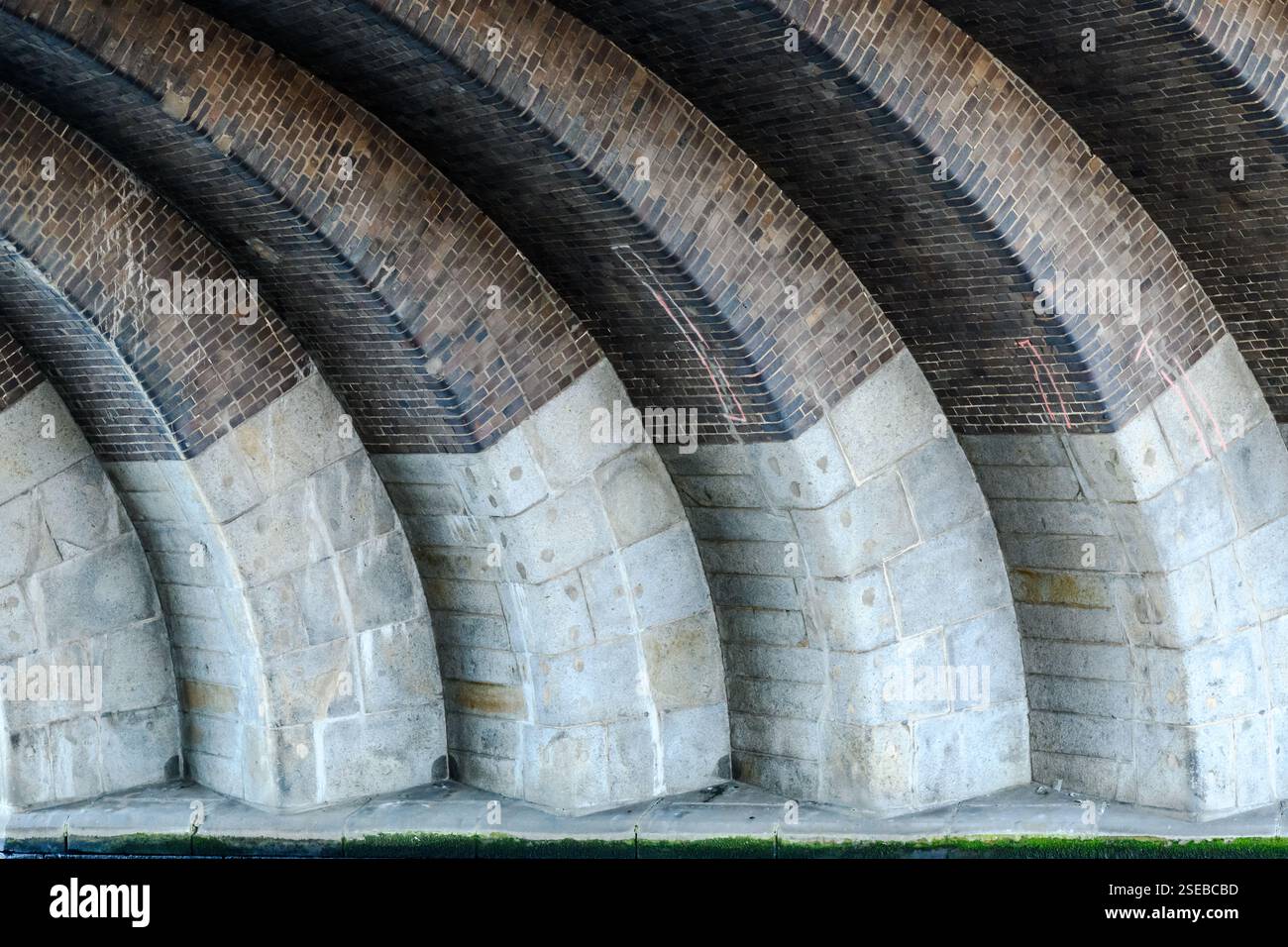 Brick arches of a Berlin bridge, which represent several perfect arches ...