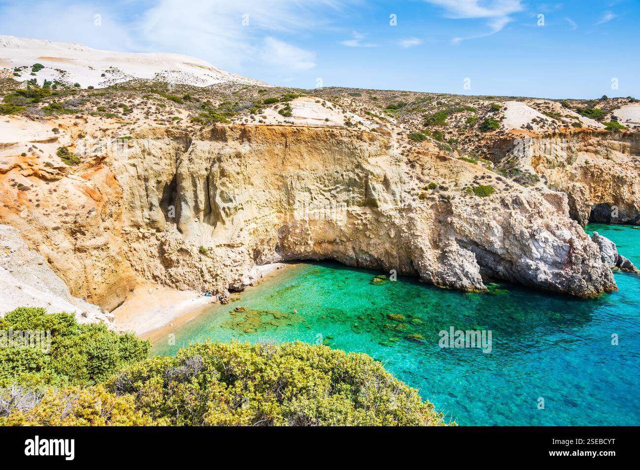 View of beautiful sandy Tsigrado beach with azure sea water, Milos ...