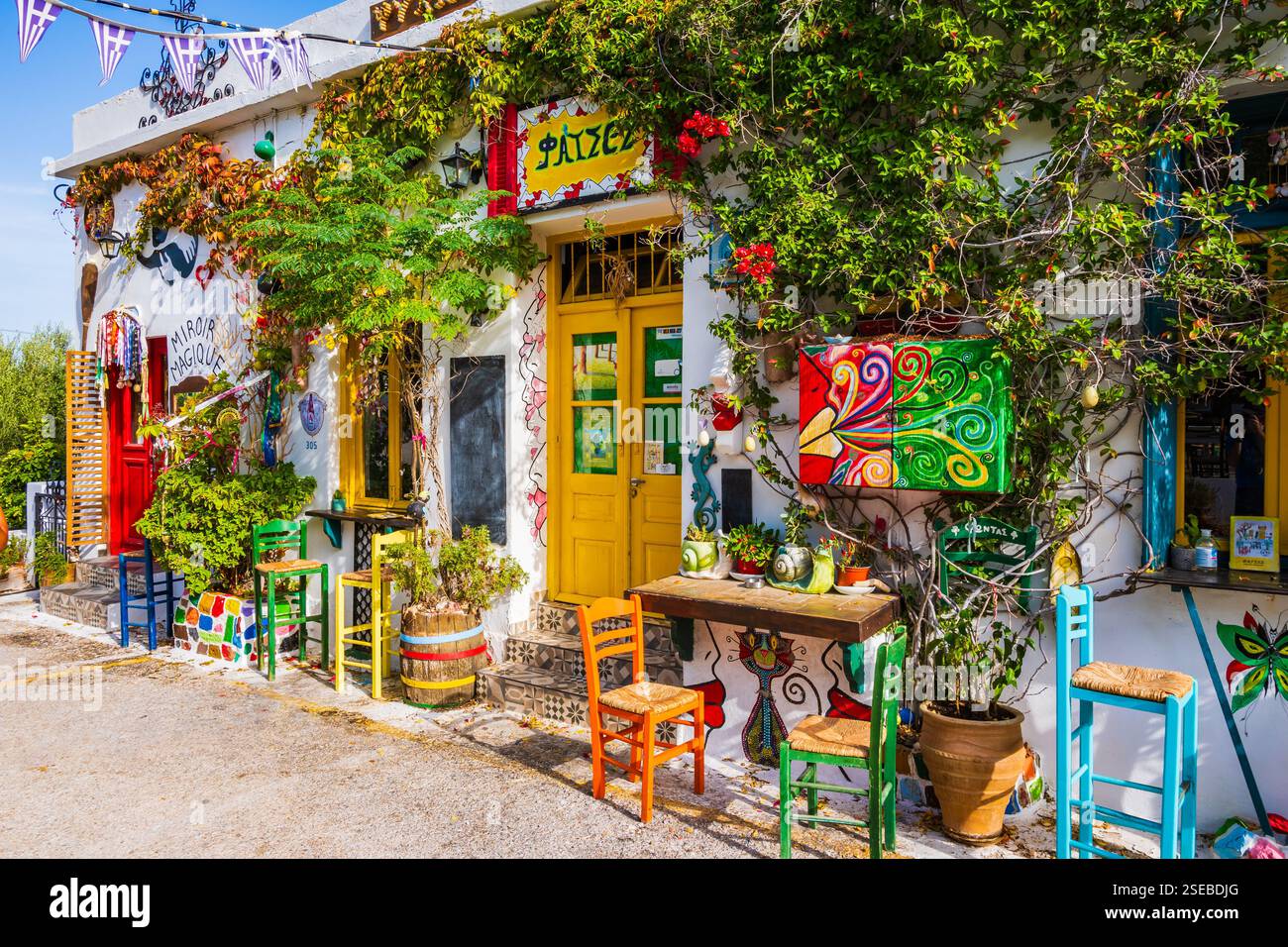 PLAKA VILLAGE, MILOS ISLAND - SEP 24, 2023: Colorful tavern chairs with ...