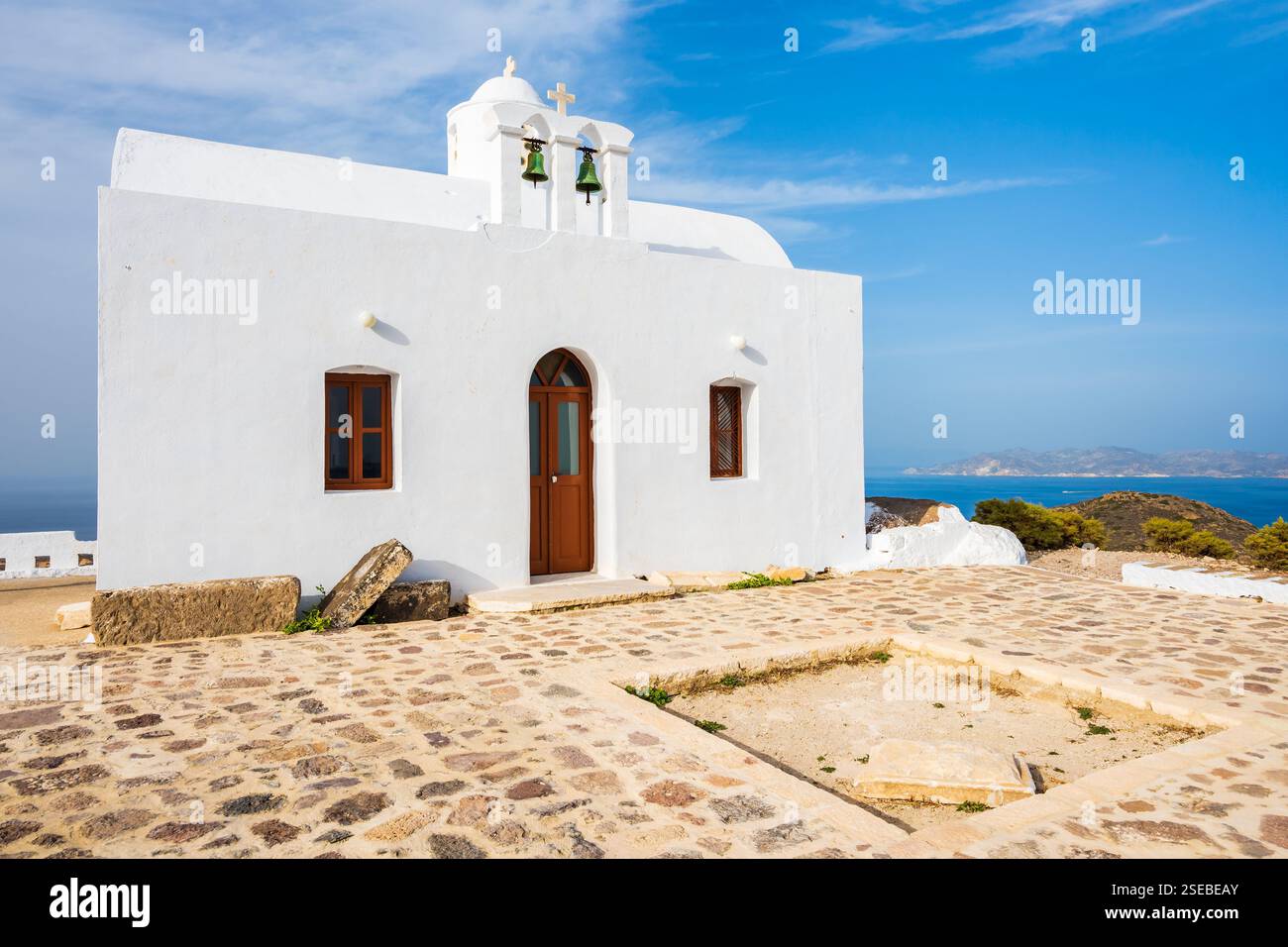 Traditional white church on top of hill in Plaka village, Milos island ...