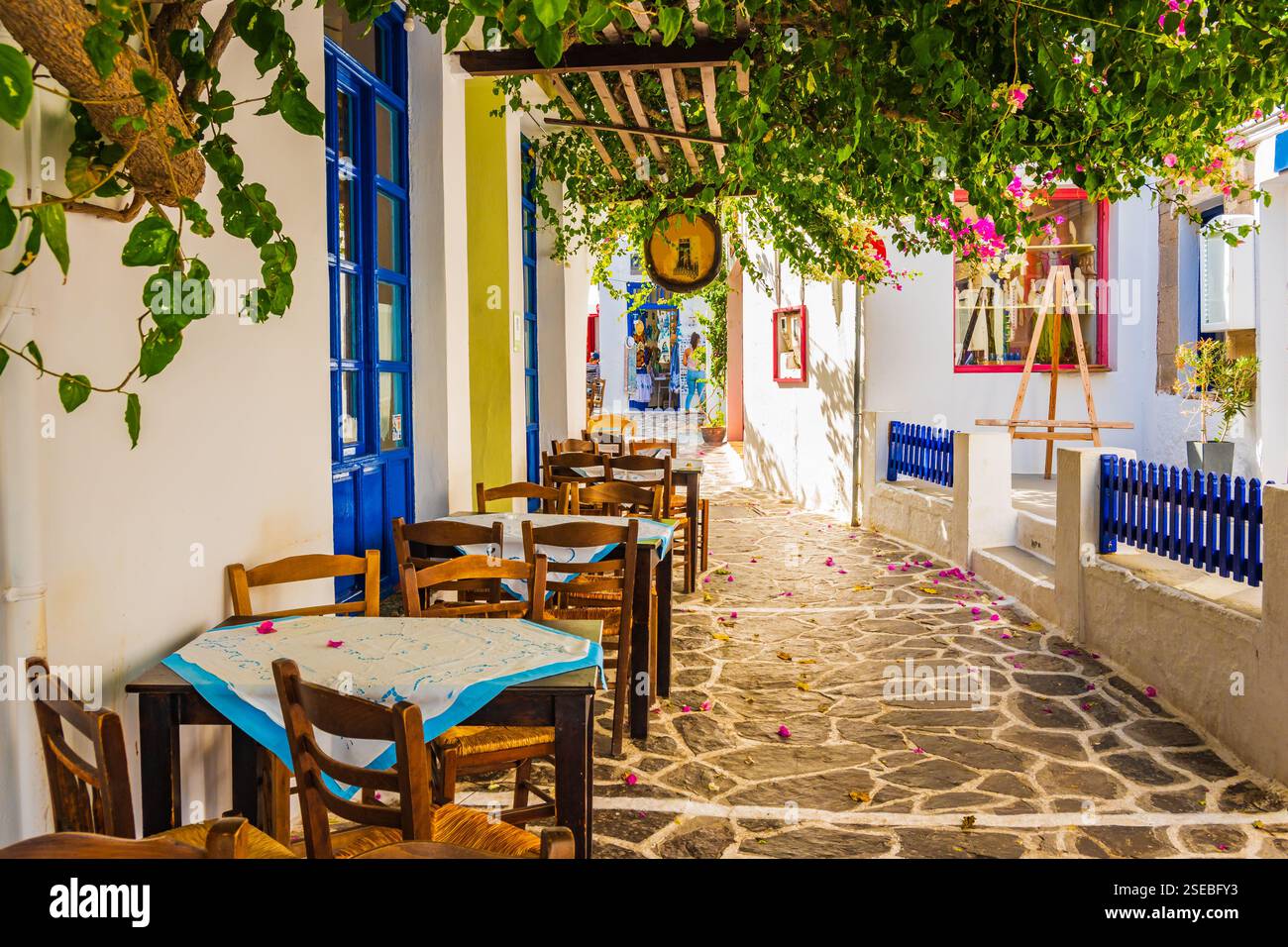 Chairs with tables in traditional Greek restaurant tavern in Plaka ...