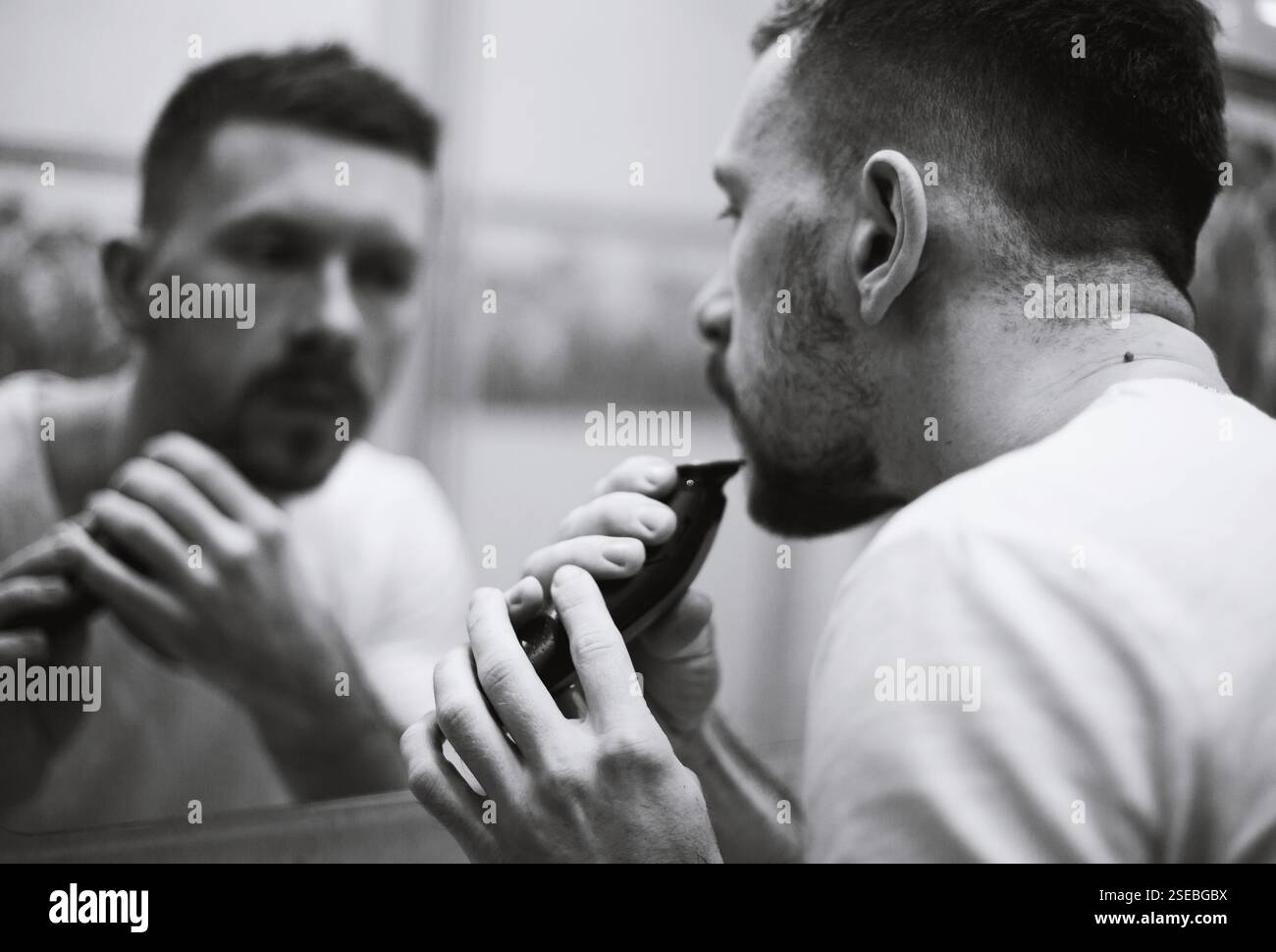 Handsome man in front mirror hi-res stock photography and images - Alamy