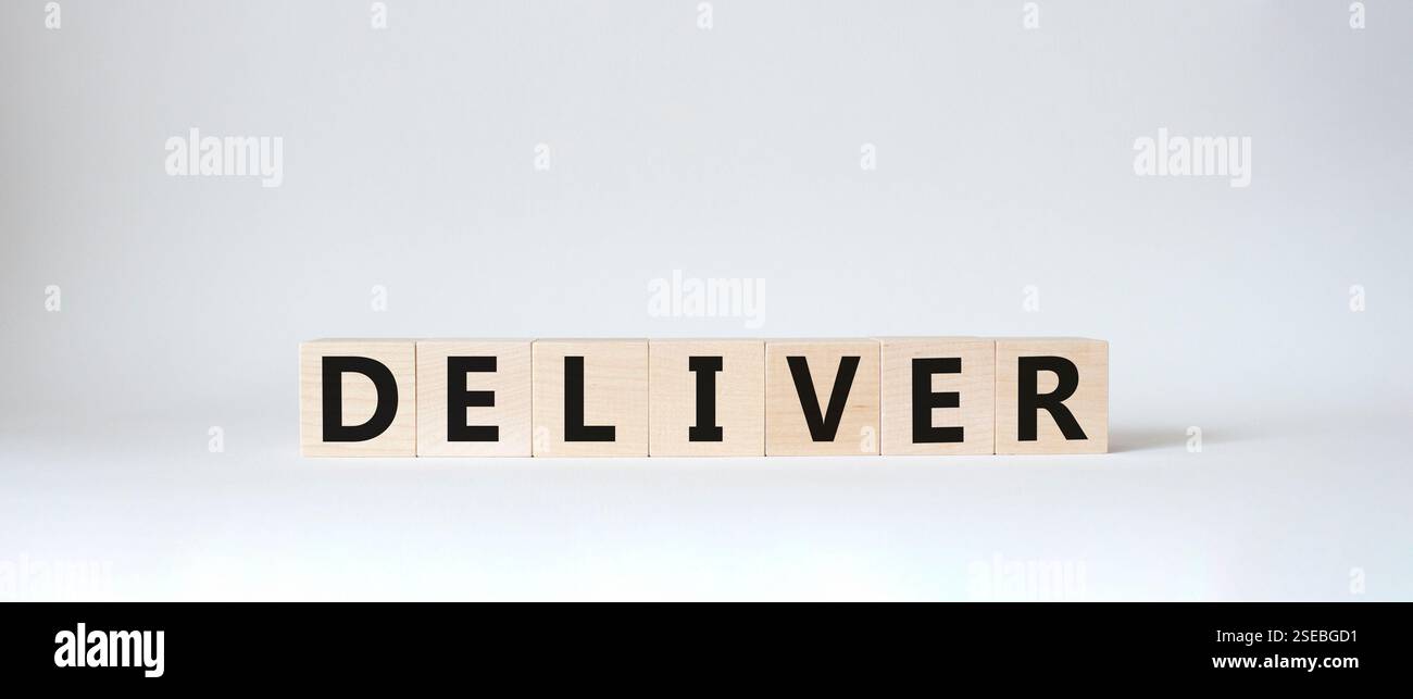 Deliver symbol. Concept word Deliver on wooden cubes. Beautiful white ...